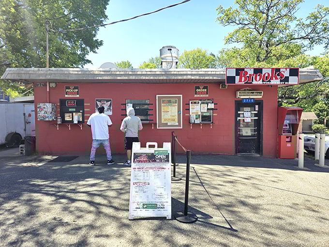 The little red burger shack that could! Brooks Sandwich House stands proudly in Charlotte's NoDa district, a beacon of no-frills culinary excellence.