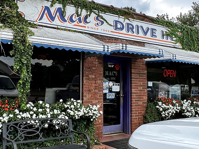 Mac's Drive In stands proudly since 1956, its ivy-draped brick exterior and vibrant flower boxes promising a taste of Clemson tradition that transcends time.