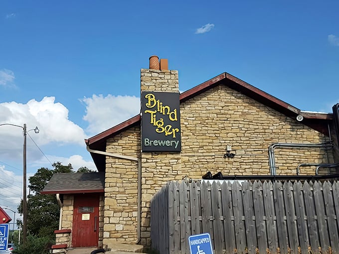 The stone facade of Blind Tiger Brewery stands like a rustic fortress of flavor, promising craft beer treasures within its walls.