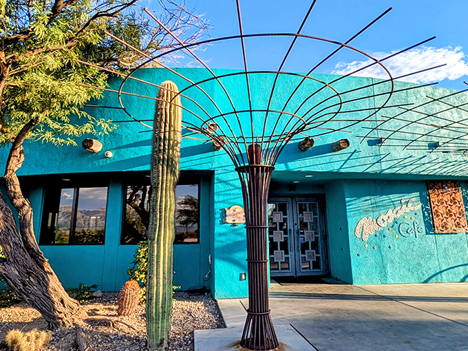 The turquoise jewel of Tucson beckons with its striking facade, where metal ocotillo sculptures create desert-inspired art that's as inviting as the food inside.