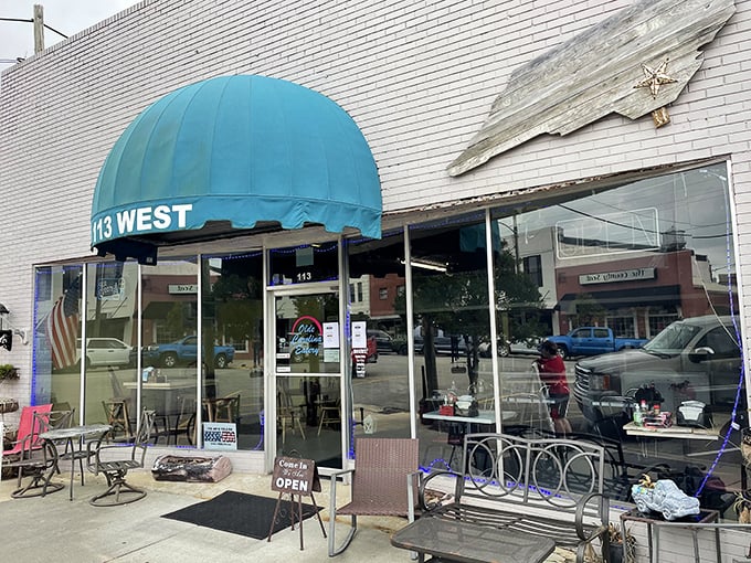 The iconic teal awning of Olde Carolina Eatery stands out on Burgaw's main street like a beacon for hungry travelers seeking authentic Southern comfort.