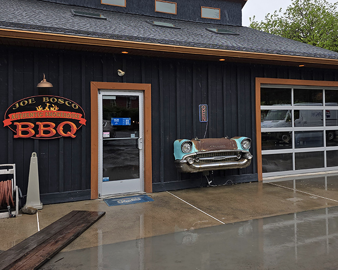 The black exterior with vibrant orange trim and classic BBQ signage announces itself like a beacon to hungry travelers on the Pennsylvania backroads.