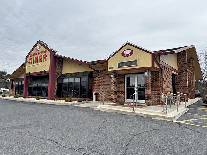 The brick and burgundy exterior of Walnut Bottom Family Diner stands like a lighthouse for hungry souls, promising comfort food salvation just off the highway.
