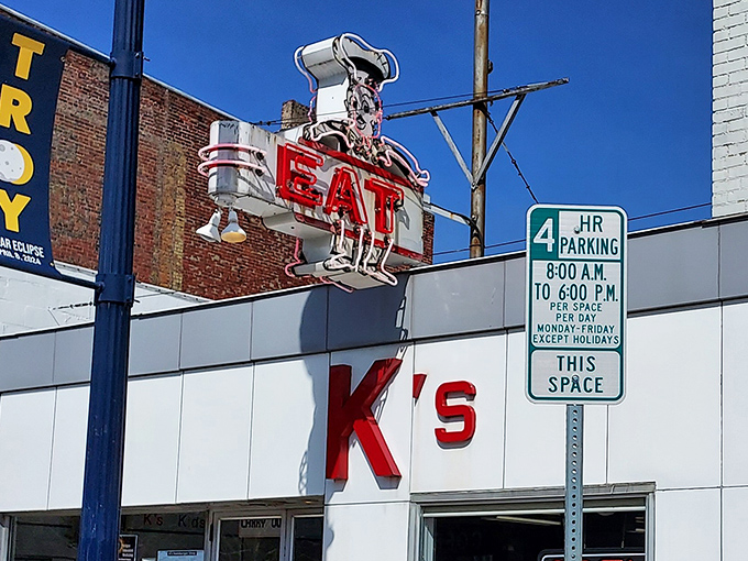 That vintage neon "EAT" sign isn't just advertising &ndash; it's a time portal to when diners were America's living rooms with better coffee.