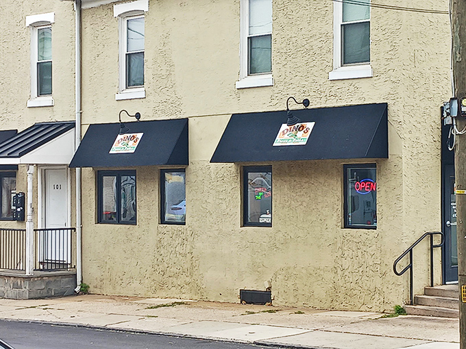 The classic awnings and textured walls whisper "neighborhood gem" louder than a South Philly argument about cheesesteaks.