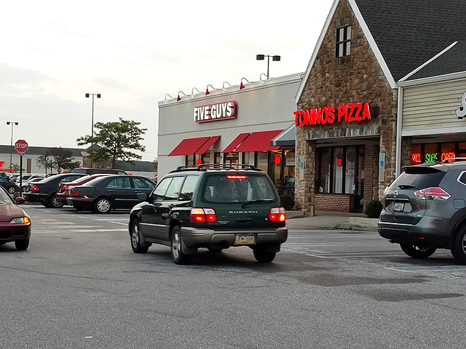 Tonino's unassuming storefront sits beside a Five Guys, proving that sometimes the best pizza treasures hide in plain sight at suburban strip malls.