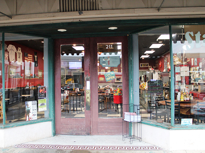 The classic storefront with its green and red awning beckons hungry visitors like a lighthouse for breakfast lovers.
