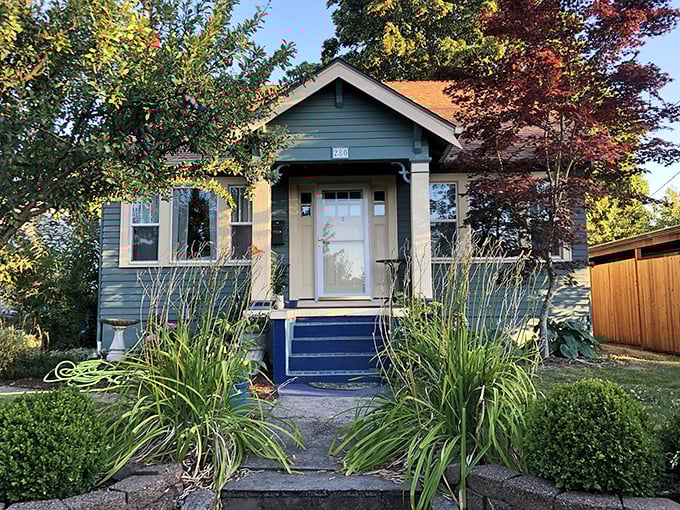 The unassuming blue bungalow that houses culinary greatness. Like finding Shakespeare writing in a garden shed&mdash;unexpected but magical.