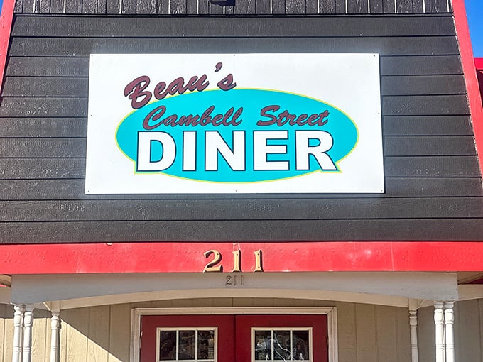 The bright red roof of Beau's Cambell Street Diner stands out like a beacon for hungry travelers seeking breakfast nirvana.