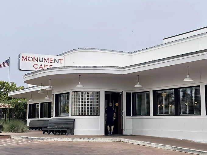 The gleaming white exterior of Monument Cafe stands like a time capsule from a more delicious era, complete with that iconic curved roofline that screams "good food happens here."
