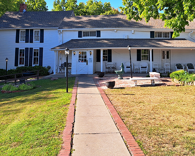 The classic white farmhouse exterior of Stroud's Oak Ridge Manor beckons with a promise of comfort food that transcends trends. Simple, unpretentious, and absolutely magical.