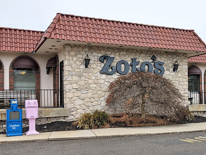 Morning sunshine highlights Zoto's charming exterior, where newspaper boxes stand sentinel outside this beloved local institution that's been filling Pennsylvania bellies for generations.