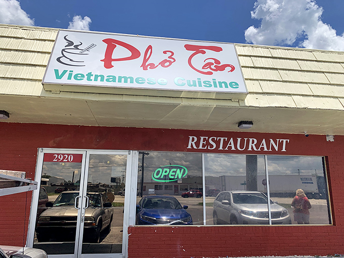 That red brick exterior and neon "OPEN" sign are your first clue that something special awaits inside this Lakeland gem.