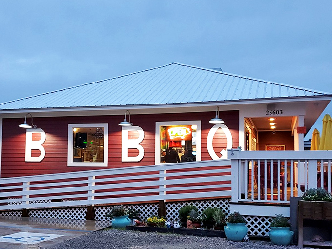 As evening approaches, Moe's warm glow spills onto the deck &ndash; a beacon of barbecue hope for hungry travelers seeking smoky salvation.