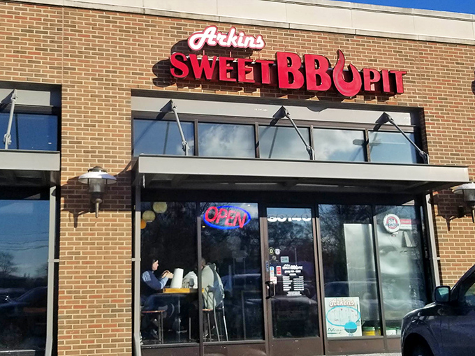 Morning light catches Arkins' iconic sign, promising smoky delights within. That neon "OPEN" sign might as well say "Heaven's Gates Unlocked."