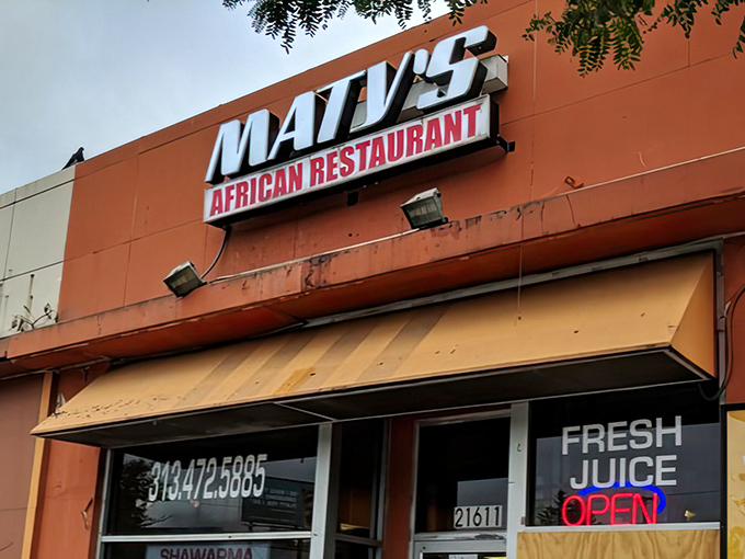 That orange exterior might look humble, but inside lies Detroit's West African culinary treasure waiting to be discovered.