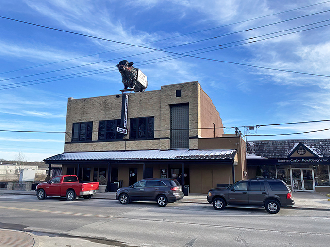 The unassuming brick exterior of Jess & Jim's, complete with its iconic steer sign, promises authentic steakhouse magic within. No pretension, just perfection.