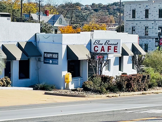 The unassuming exterior of Blue Bonnet Cafe stands like a culinary lighthouse in Marble Falls, beckoning hungry travelers with promises of homestyle cooking and pie happy hours.