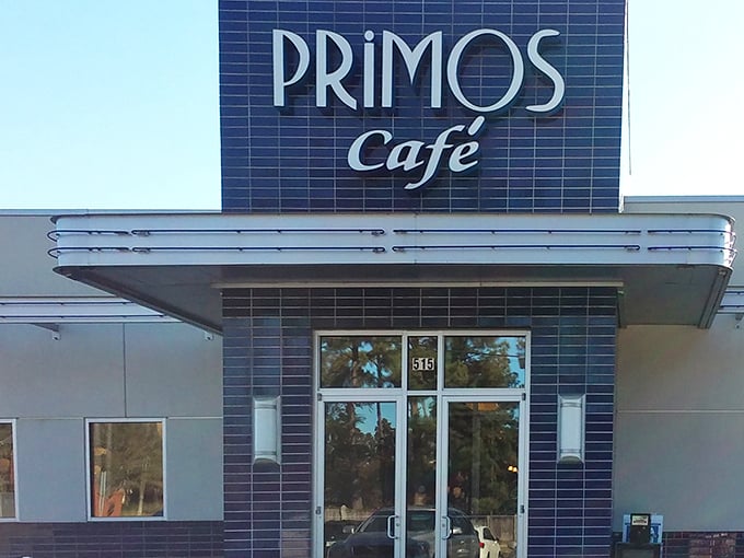 The sleek blue-tiled entrance of Primos Cafe promises Southern hospitality with a contemporary twist.