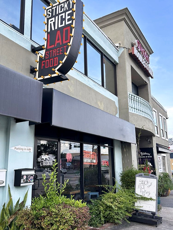 The marquee sign for Sticky Rice glows with promise, like a beacon calling to hungry travelers in Orlando's Mills 50 district.