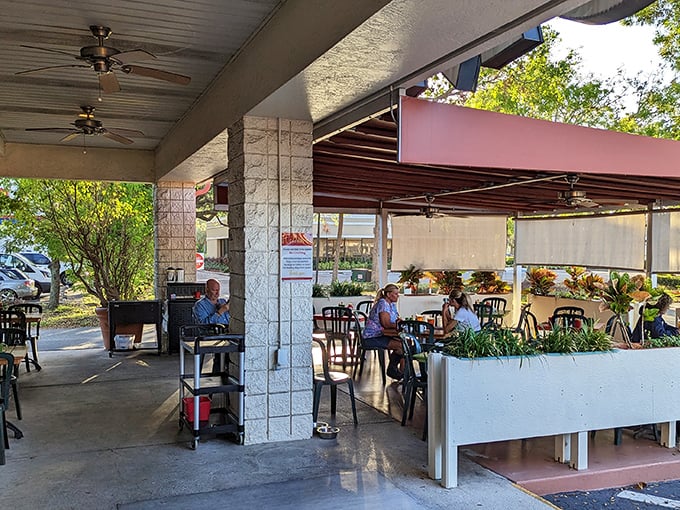 The outdoor seating at Skillets offers a perfect Florida morning escape, where ceiling fans keep the breeze flowing and conversations flowing even better.