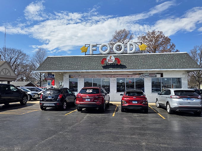 The humble white exterior belies the culinary treasures within. That "FOOD" sign might be the greatest understatement in Illinois roadside dining.