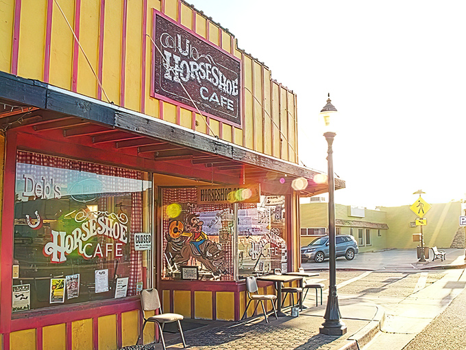 The sunshine-yellow exterior of Horseshoe Cafe stands like a beacon of breakfast hope on Wickenburg's main street, promising comfort food and cowboy charm.