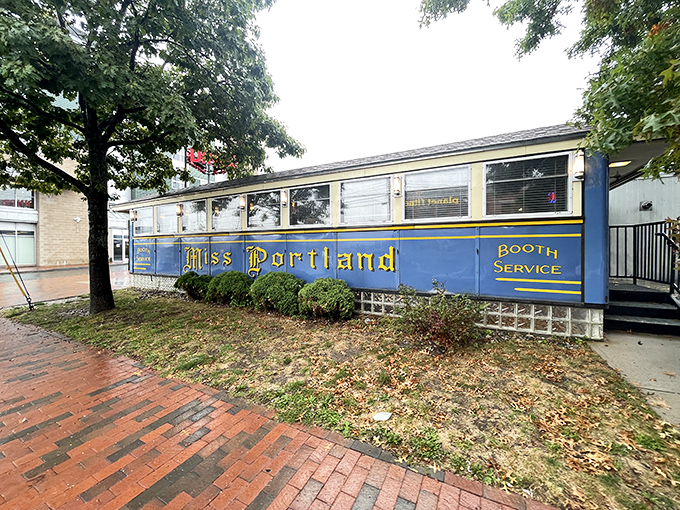 The iconic blue exterior of Miss Portland Diner gleams like a time capsule on wheels, complete with vintage "BOOTH SERVICE" lettering that promises authentic diner magic.