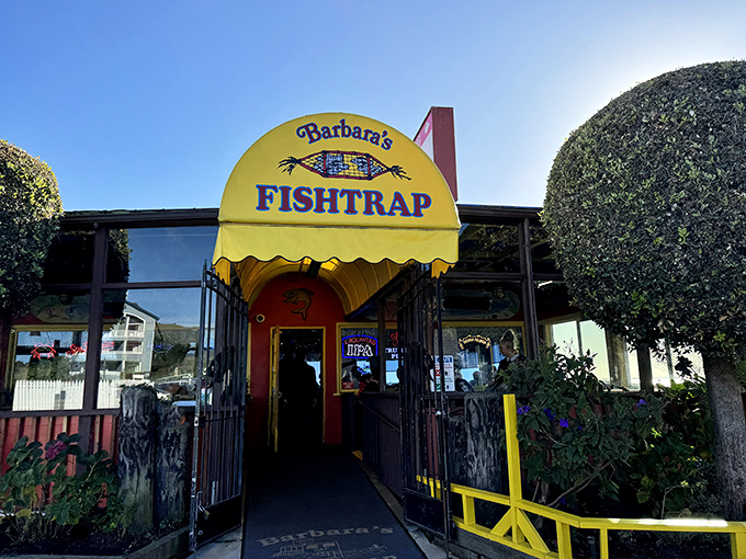 The bright yellow awning of Barbara's Fishtrap beckons like a culinary lighthouse, promising seafood treasures within this unassuming Half Moon Bay institution.