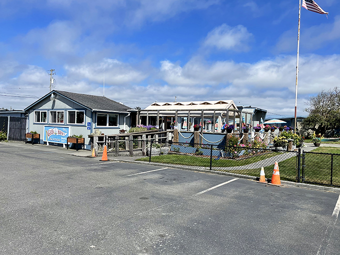The unassuming blue exterior of Gill's By the Bay stands like a beacon for seafood lovers, promising authentic coastal flavors without the tourist trap theatrics.