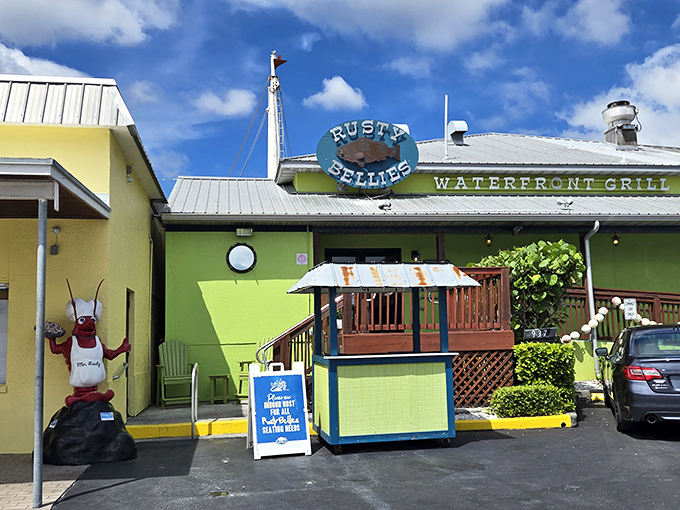 The lime-green exterior of Rusty Bellies pops against the Florida sky like a tropical bird showing off for a mate.