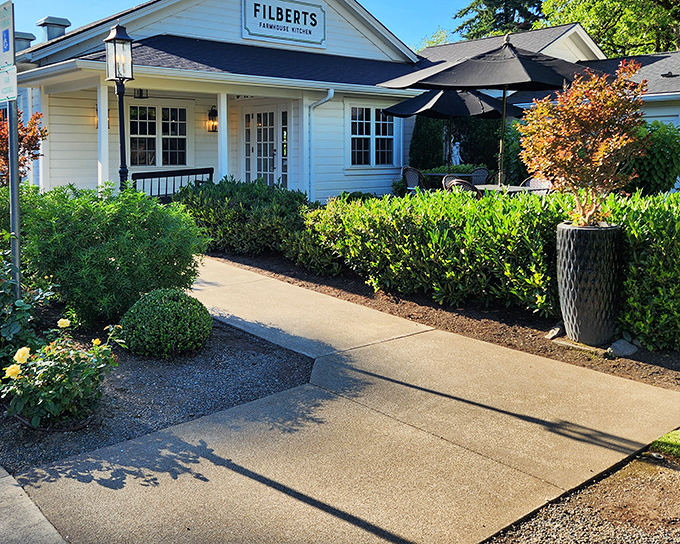 The white farmhouse exterior of Filberts beckons like an old friend, promising comfort food and conversation in equal measure.