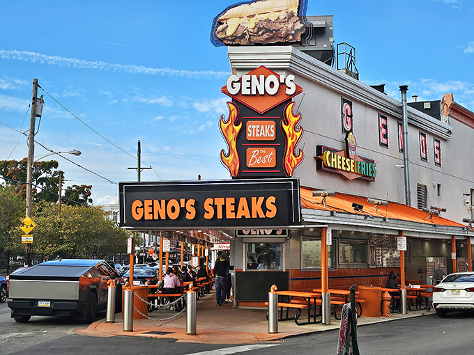 The iconic orange and red neon glow of Geno's Steaks stands like a culinary lighthouse in South Philly, beckoning hungry pilgrims to the cheesesteak promised land.