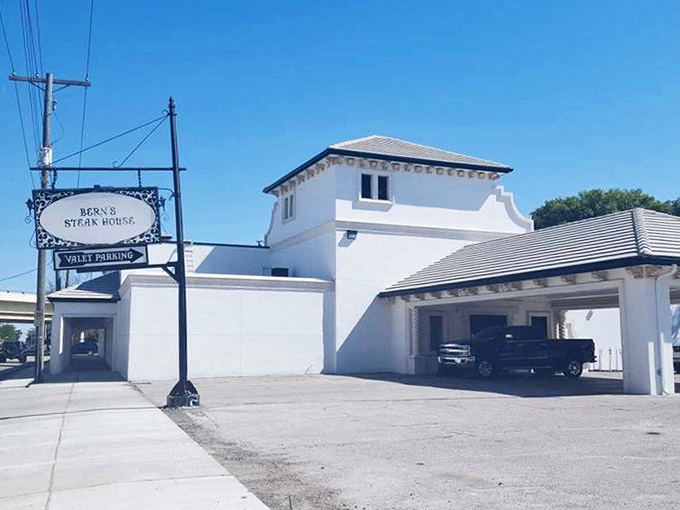 1. the best french onion soup in florida is hiding inside this unfussy restaurant
The iconic Bern's Steak House sign glows like a beacon in Tampa's night, promising culinary adventures that have delighted generations of food lovers.