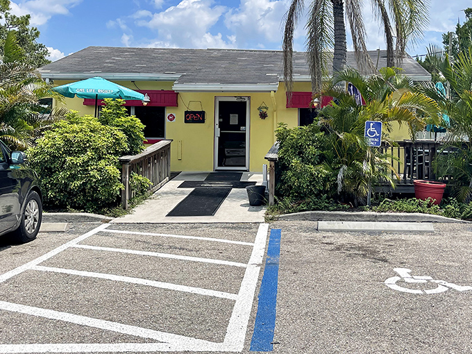 The cheerful yellow exterior of Leo's French Toast House stands like a beacon of breakfast hope in Alva, where palm trees and hungry locals gather daily.
