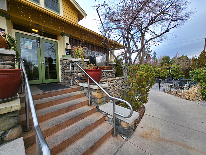 The Stone House Caf&eacute;'s charming exterior welcomes you with rustic stone steps and green doors, like a secret garden hideaway in the middle of Reno.