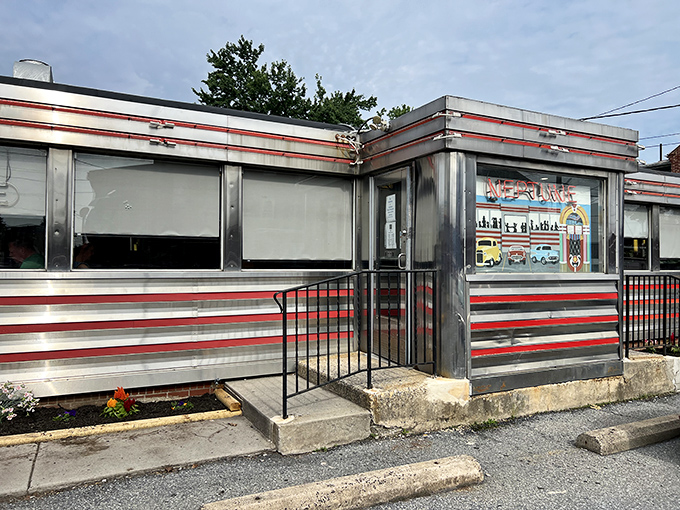 The interior showcases that quintessential diner DNA&mdash;burgundy booths, chrome accents, and ceiling fans that have witnessed countless breakfast debates.