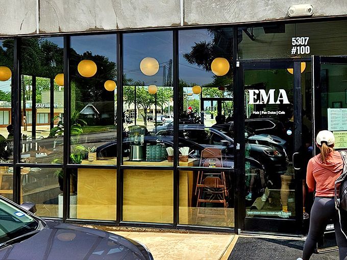 The storefront beckons with warm golden lights and sleek glass windows &ndash; Houston's best-kept secret hiding in plain sight.