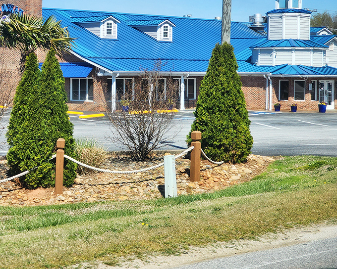 The iconic blue roof of Blue Ocean Seafood Restaurant stands out like a sapphire against the Clinton sky, promising oceanic treasures within those brick walls.