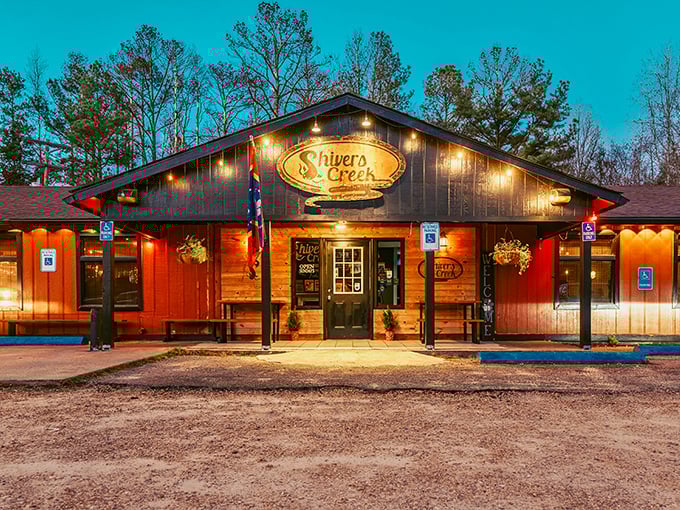 The red wooden exterior glows like a beacon at dusk, promising Southern comfort and catfish treasures within those rustic walls.