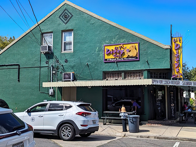 The unassuming green exterior of Li'l Dizzy's Cafe stands like a culinary lighthouse in Treme, beckoning hungry travelers with promises of Southern comfort.