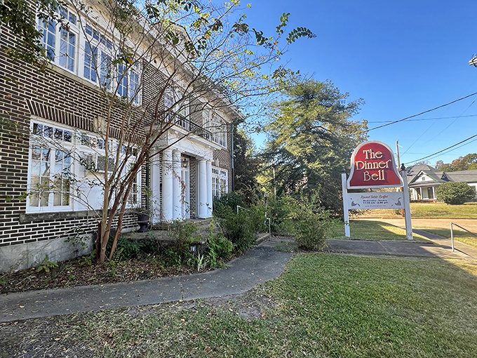 The Dinner Bell's stately brick exterior and white columns aren't just Southern charm &ndash; they're the gateway to a fried chicken paradise hiding in plain sight.