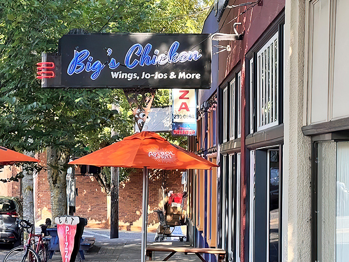 The blue neon glow of Big's Chicken sign acts like a beacon for hungry Portlanders. Those orange umbrellas promise a sunny experience regardless of Oregon's notorious weather.