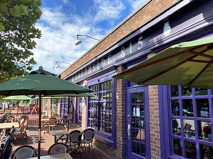 The purple-trimmed facade of Southside 815 stands out like a welcoming beacon, promising Southern comfort in Alexandria's historic streets.