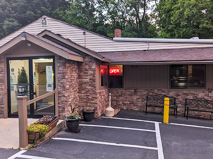 The unassuming stone exterior of Oak Park Tavern hides culinary treasures within, like a delicious secret waiting to be discovered in Mansfield's wooded embrace.