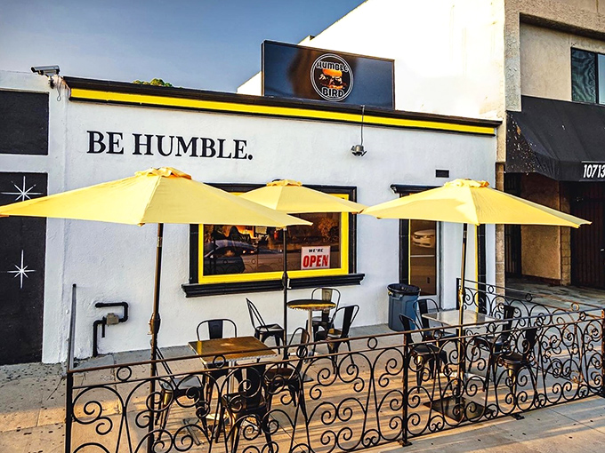 The bright yellow umbrellas and bold "BE HUMBLE" signage aren't just eye-catching&mdash;they're your beacon to Nashville-style chicken nirvana in North Hollywood.