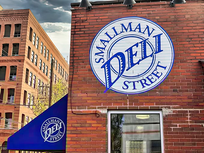 The iconic blue awning and brick facade of Smallman Street Deli stands as a beacon of sandwich salvation in Pittsburgh's Strip District.