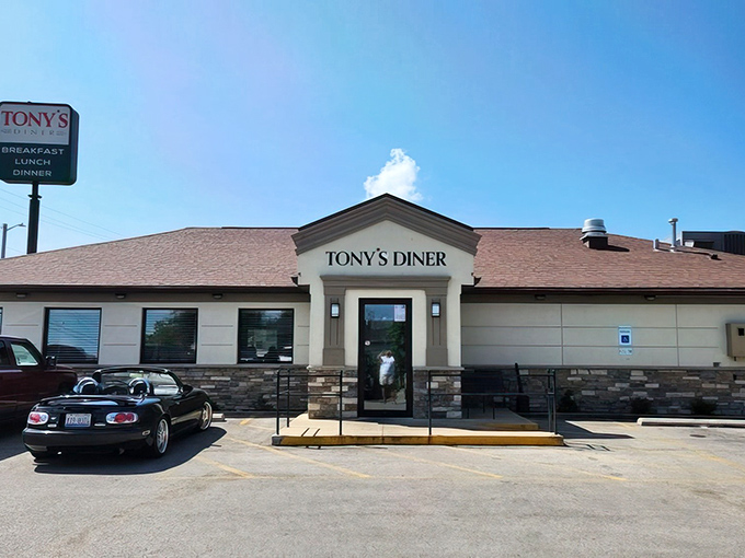 Morning sunshine bathes Tony's Diner in golden light, as if the breakfast gods themselves are highlighting your next delicious destination. The convertible in the lot suggests someone's day is already looking up.