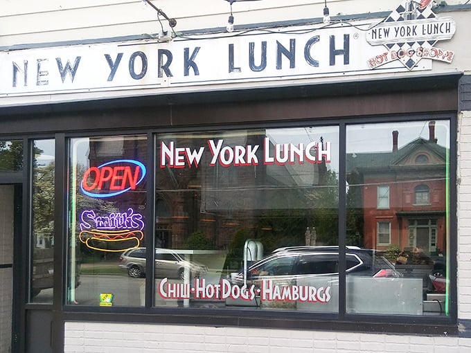 The neon glow of "Smith's" hot dogs and that iconic "OPEN" sign – Erie's version of the Bat Signal for hungry locals.