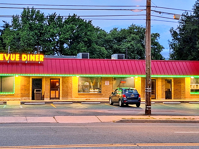 The iconic red roof of Bellevue Diner stands out against the evening sky, beckoning hungry Delawareans to its unpretentious brick facade.